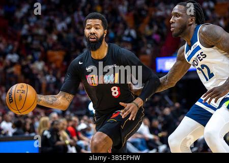 Miami Heat forward Markieff Morris, right, talks with assistant coach ...