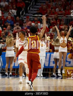 Iowa State guard Tyrese Hunter (11) goes to the basket between Oklahoma ...