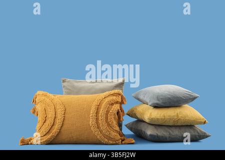 Different pillows on blue background Stock Photo - Alamy