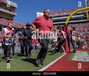 Arkansas coach Sam Pittman leads his team onto the field to play ...