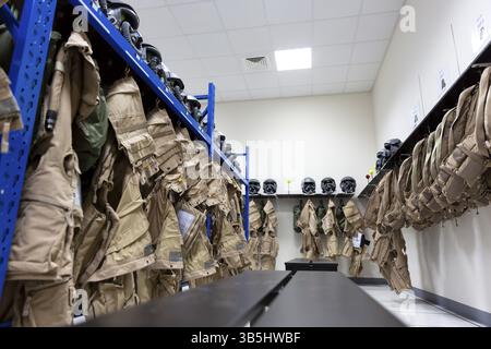 Dressing room of a fighter aircraft (jet fighter) pilot with uniforms ...