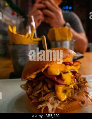 Delicious Burger Topped With Bacon, Cheese, and Fresh Greens Ready to ...