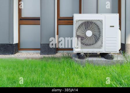 outdoor air conditioner unit on the wall of a building Stock Photo - Alamy