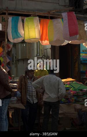 bunch of multicolored balloons in the city festival on clear blue sky ...