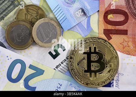 20 euro bills and golden bitcoins. Cryptocurrency investment concept ...