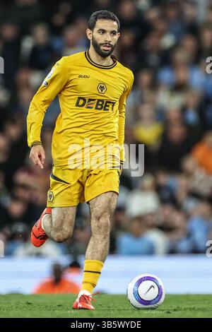 Rayan Aït-Nouri Of Manchester City inspects the pitch during the ...