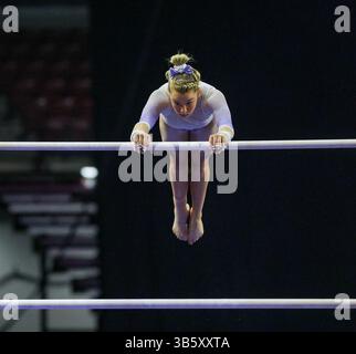 Charlotte Booth competes on the uneven bars during the U.S. Gymnastics ...