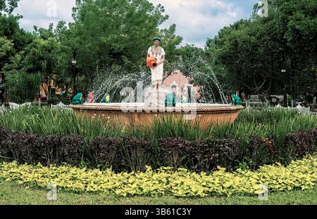 Female Mayan figure woman holding water jug in fountain, Francisco ...