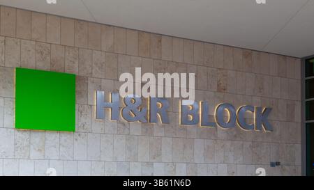 The H and R Block sign at the headquarters in Kansas City, MO, USA ...