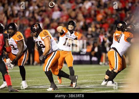 BC Lions quarterback Nathan Rourke (12) lines up a pass during second ...