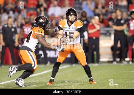 B.C. Lions quarterback Nathan Rourke (12) throws the ball past Hamilton ...