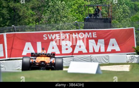 Drivers head to turn one during the second lap of a NASCAR Truck Series ...
