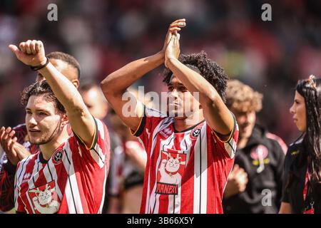 Sam McCallum of Sheffield United applauds the fans after being subbed ...