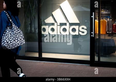 Adidas outlet store storefront logo and banner Stock Photo - Alamy