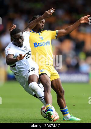 Port Vale's Jesse Debrah (left) and Gillingham's Aaron Rowe battle for ...
