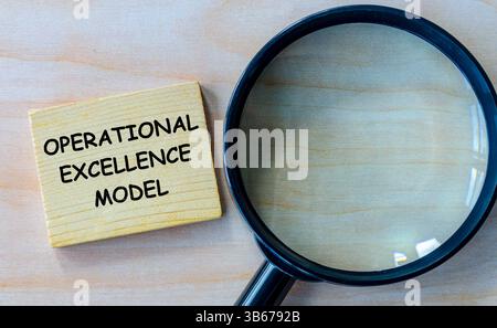 Operational Excellence Model text on wooden blocks with magnifying ...