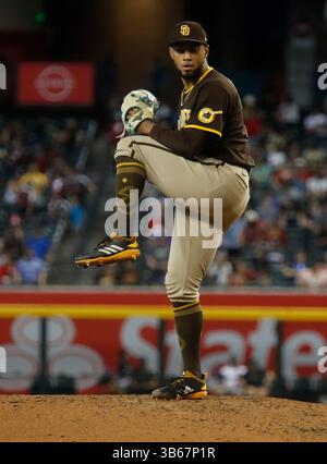 San Diego Padres' Robert Suarez claps after the final out is recorded ...