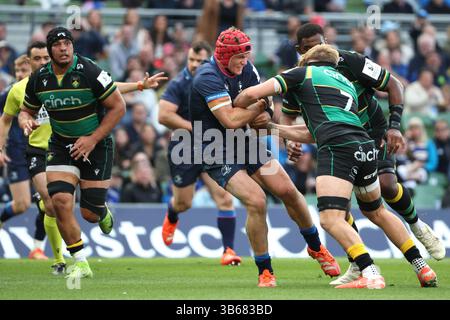 Leinster Rugby's Josh van der Flier (left) is tackled by Stade ...