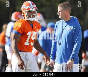 Florida head coach Billy Napier, center, looks on from the sideline ...