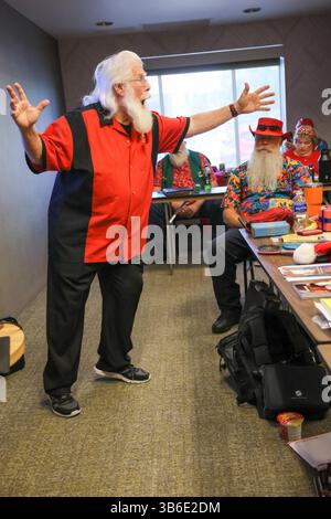 A group of Santas and Mrs. Clauses attend the International University ...