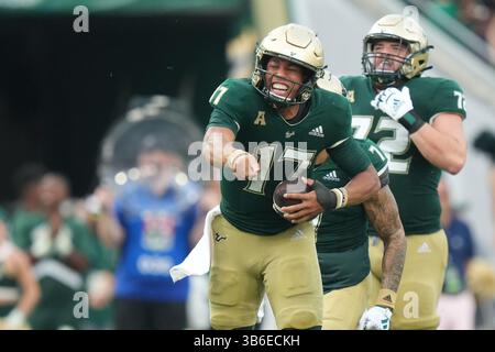 South Florida Bulls quarterback Byrum Brown (17) breaks tackles as he ...