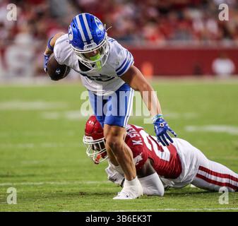 BYU wide receiver Parker Kingston (11) evades the tackle of West ...