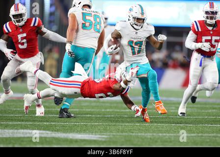 New England Patriots cornerback Marcus Jones (25) drops into coverage during the first half an ...