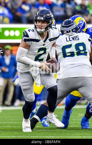Seattle Seahawks quarterback Drew Lock, left, wide receiver Jaxon Smith ...