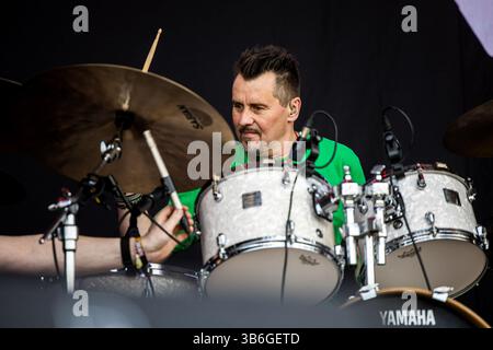 Scottish drummer Neil Primrose of Travis band, takes part in a motor ...