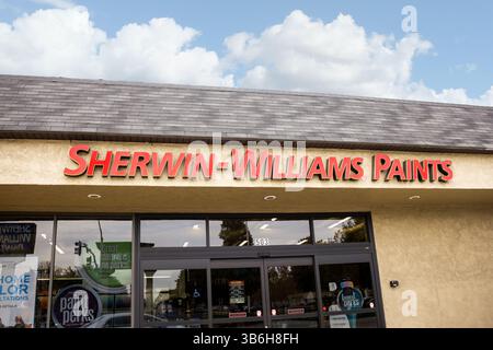 Sherwin-Williams Paints sign on exterior of white building under clear ...