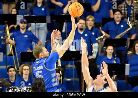 Delaware forward Tyler Houser shoots over BYU center Keba Keita during ...