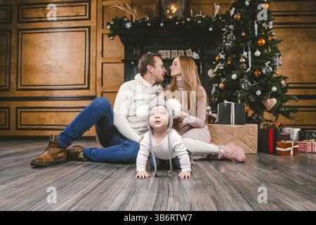 Theme family holiday New Year and Christmas. Young caucasian family mom ...