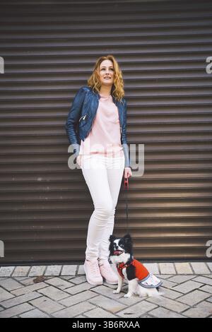 A woman takes her dogs for a walk near Coburg, Germany after a night of ...