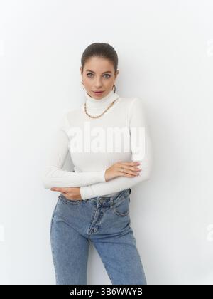 Striking fashion model poses effortlessly in a studio setting with ...