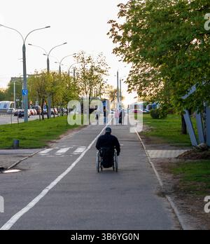 Shot of the handicapped man on the wheelchair on the city streets Stock ...