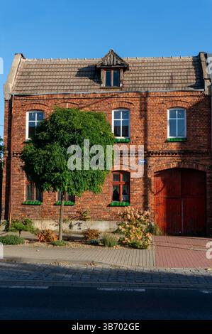 Brick house with blue door and dormer windows in Great Massingham Stock ...