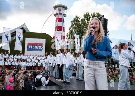 People sing during a wreath laying ceremony at The Hector Pieterson ...