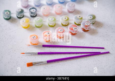 A set of colorful gouache for painting by numbers, pastel colors ...