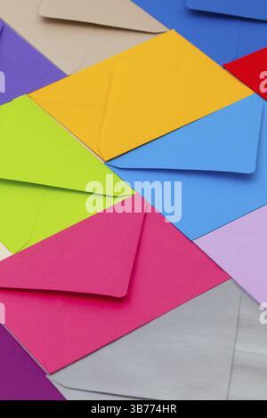 Different colored envelopes on the table Stock Photo - Alamy