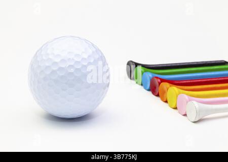 Golf set - ball with tees. Golf tees in the rainbow colors Stock Photo ...