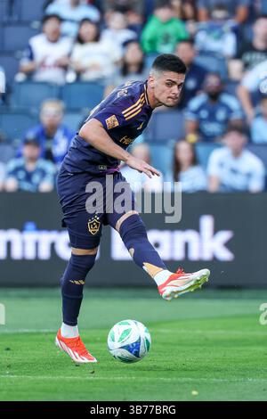 Los Angeles Galaxy forward Gabriel Pec, right, controls the ball while ...