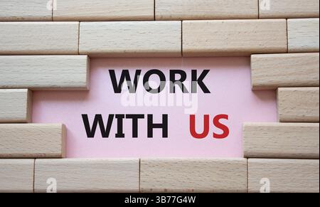 Work with us symbol. Concept words Work with us on wooden blocks on a ...