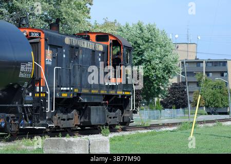 Trillium Railway "108" with a train of tank cars at Park Street, Port ...