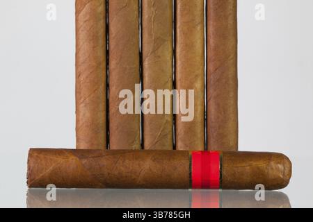 Different cigars on a glass table and black and white background Stock ...