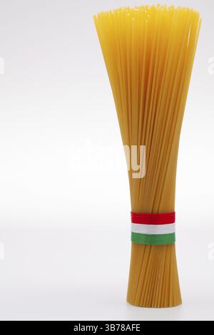 Bundle of spaghetti and Italian flag on the white background Stock ...