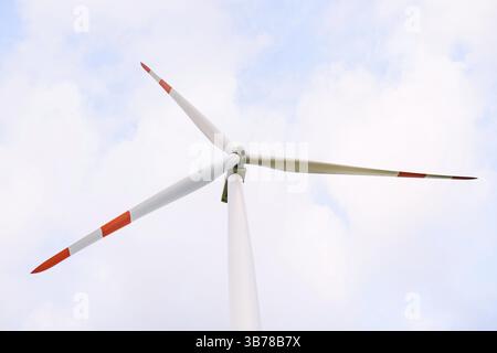 A closeup shot of a wind turbine against a blue clear sky Stock Photo ...