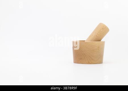 Mortar made of tropical wood on white background Stock Photo - Alamy