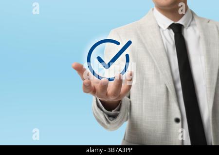 Approved. Man holding virtual check mark in hand, closeup Stock Photo ...
