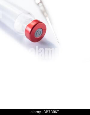 Syringe and drug bottle on red background Stock Photo - Alamy