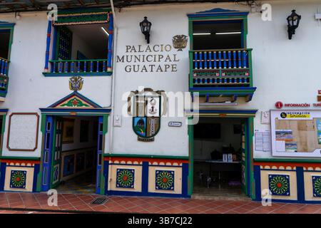 The colorfully-painted Municipal Palace with 3-D zócalo plaster wall ...